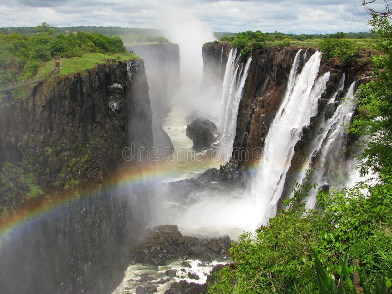 Rainbow Over Victoria Falls on Zambezi River Stock Image - Image of ...
