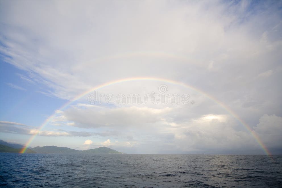 Rainbow over water stock photo. Image of exotic, seychelles - 4264210