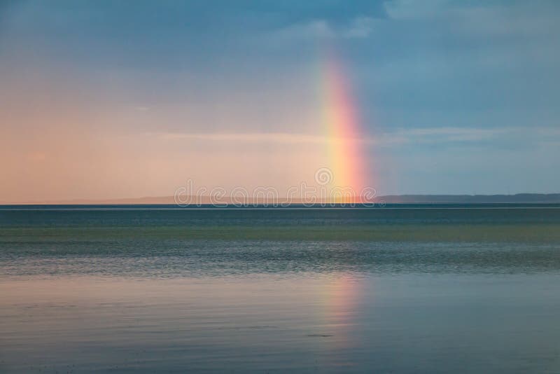 Rainbow over the water stock image. Image of beauty - 122021171