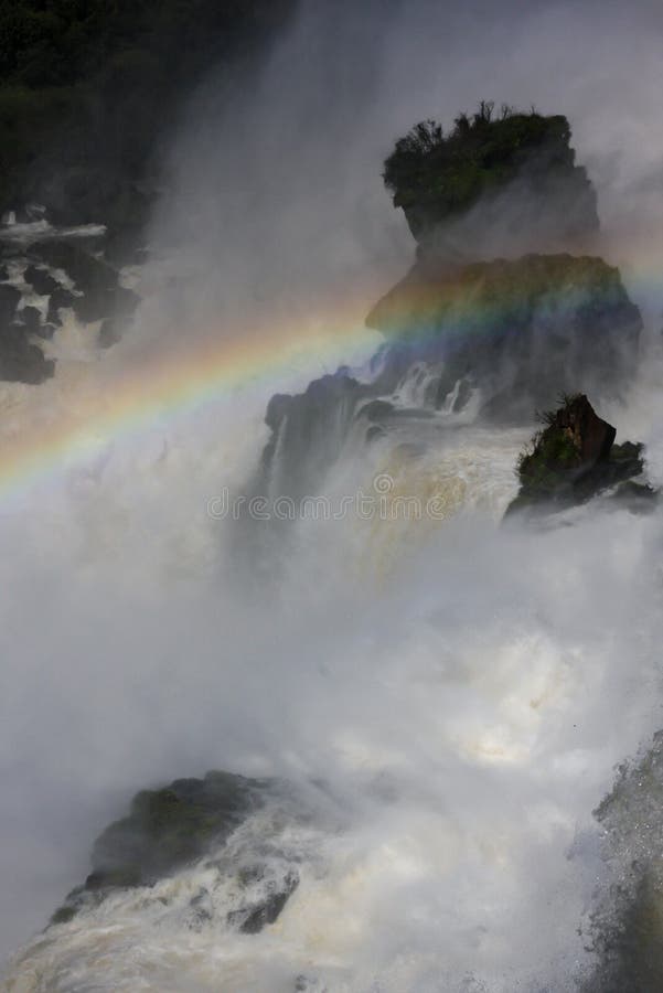 Rainbow over waterfall stock photo. Image of iguassu - 99563534