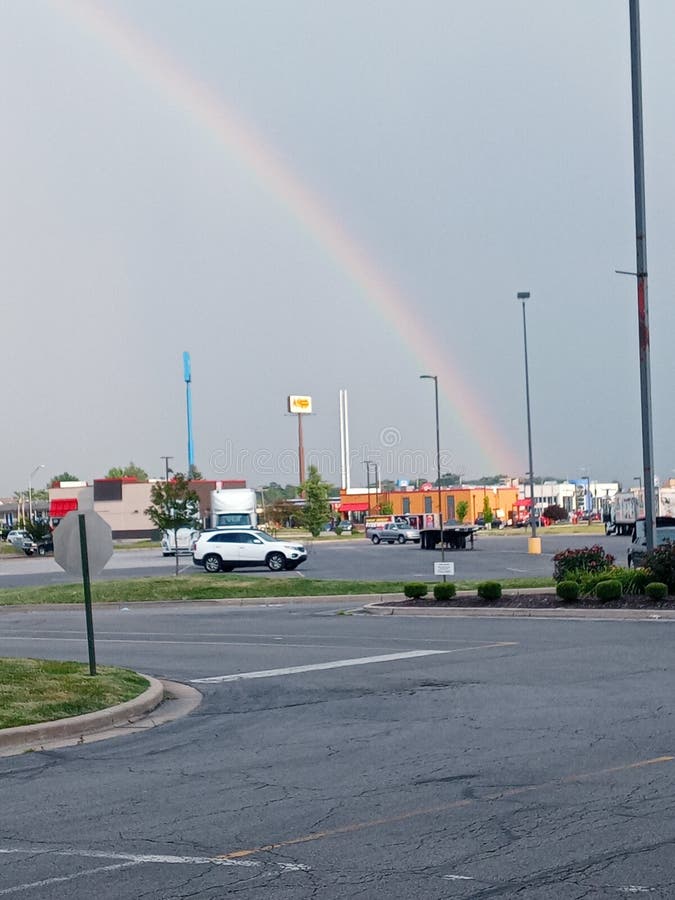 Rainbow in parking lot stock photo. Image of highway - 225128200