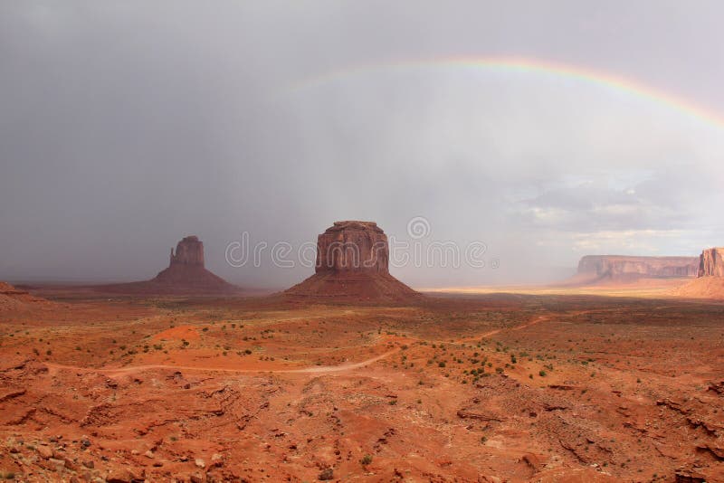 Rainbow and Passing Storm - Monument Valley, AZ Stock Image - Image of ...
