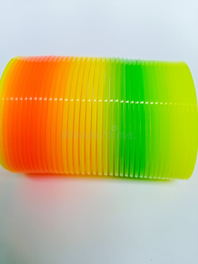 Rainbow Plastic Coil Spring Toy on White Background Editorial Stock ...