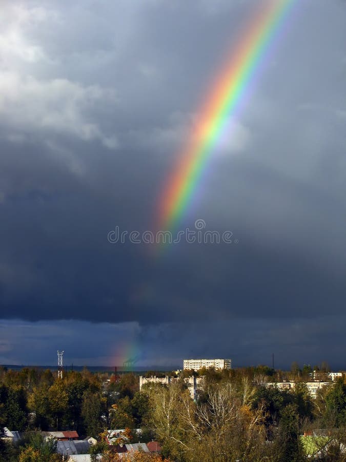 Rainbow with Rain Clouds and Blue Sky Stock Image - Image of rainy ...