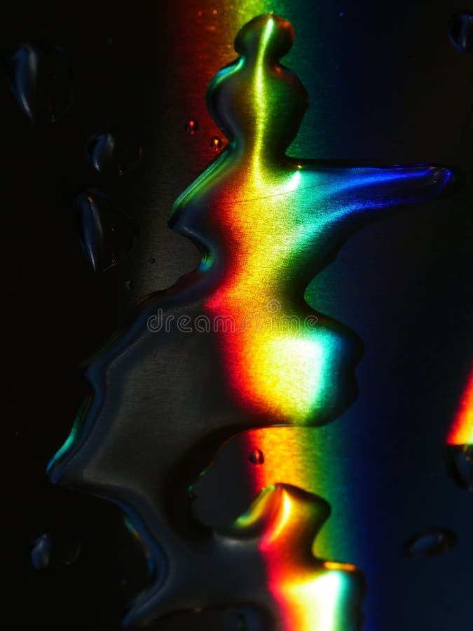 Rainbow is Reflected in a Puddle of Water Stock Image - Image of ...