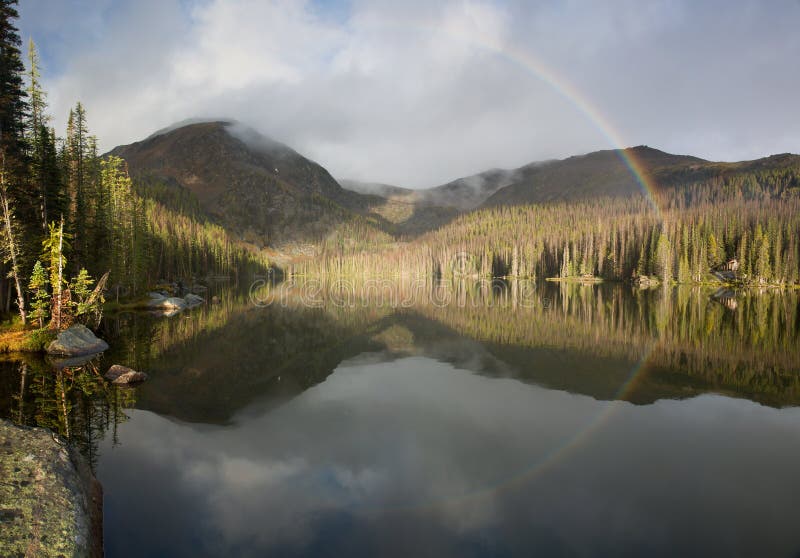 Rainbow Reflection stock photo. Image of nature, mountain - 21225756