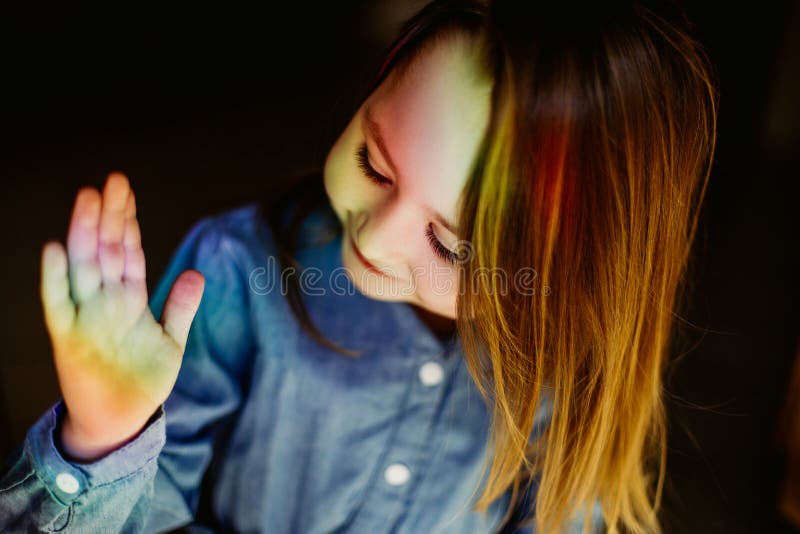 Rainbow Reflection on the Face and Hand of the Child Stock Photo ...