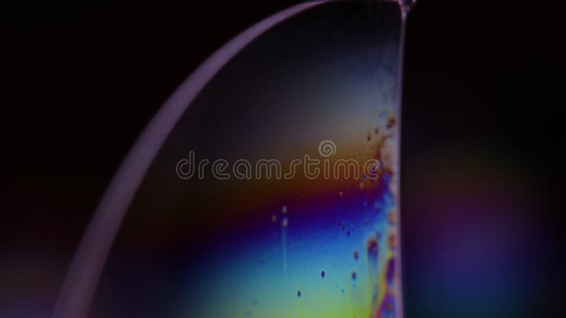 Rainbow Reflection of the Liquid on Black Background Stock Video ...