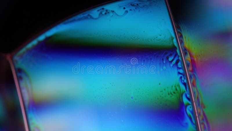 Rainbow Reflection of the Liquid on Black Background Stock Footage ...
