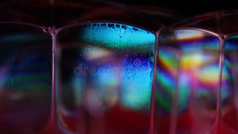 Rainbow Reflection of the Liquid on Black Background Stock Footage ...