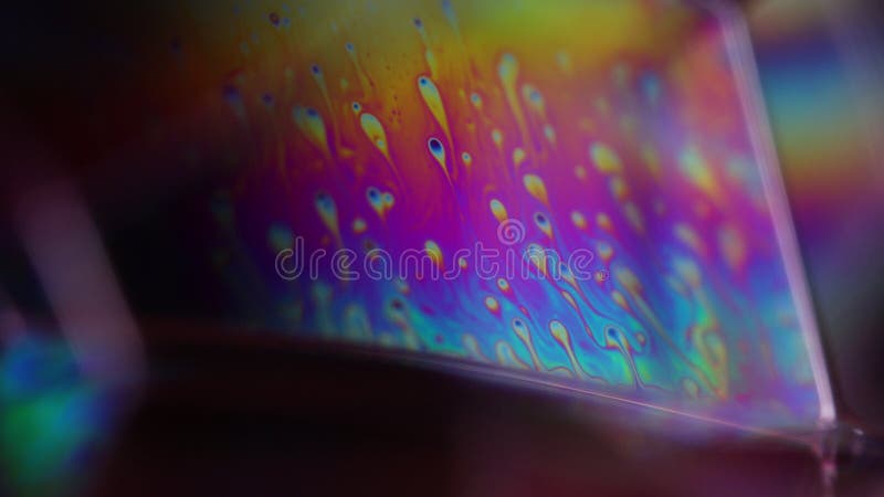 Rainbow Reflection of the Liquid on Black Background Stock Video ...