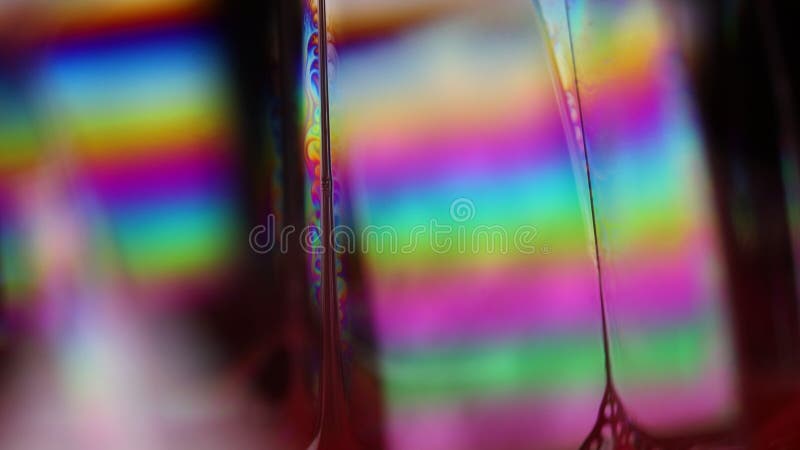Rainbow Reflection of the Liquid on Black Background Stock Video ...