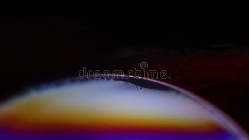 Rainbow Reflection of the Liquid on Black Background Stock Video ...