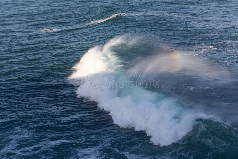 Rainbow Reflects Off Blue Sea Waves Stock Photo - Image of wave ...