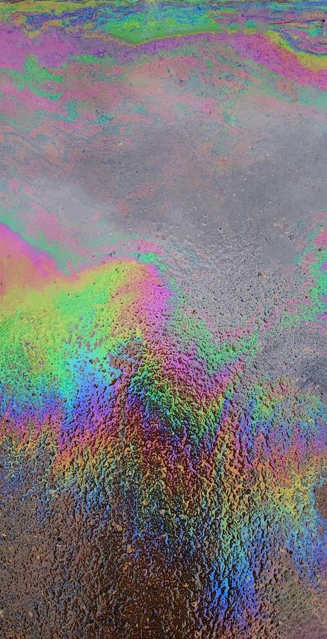 A Rainbow Remains in a Puddle after Gasoline Was Spilled Stock Image ...