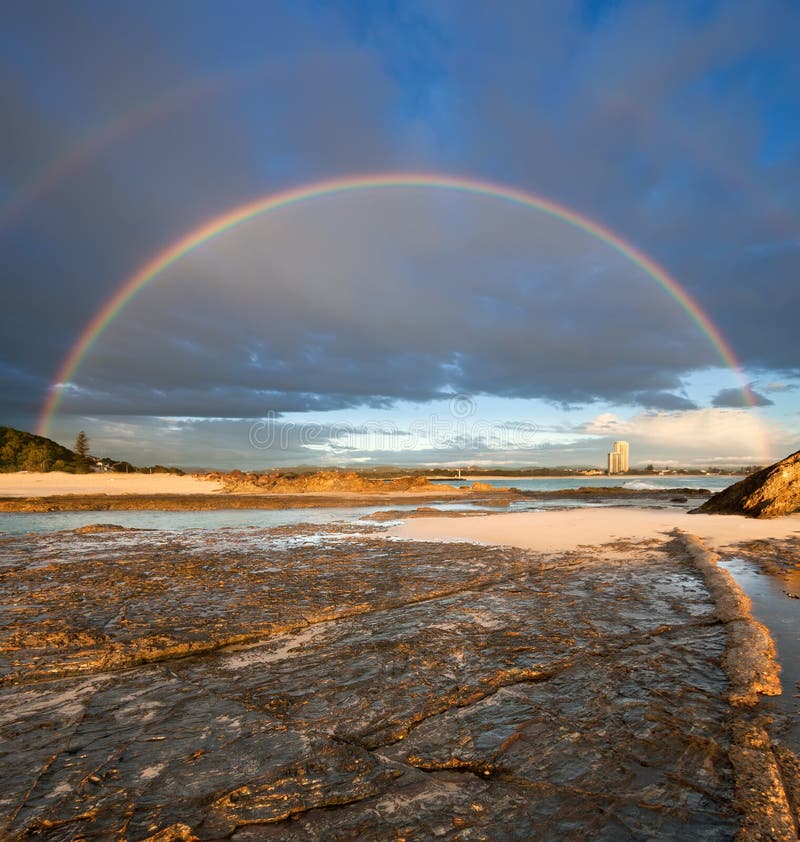 Rainbow with Rock in Foreground Stock Photo - Image of colour ...