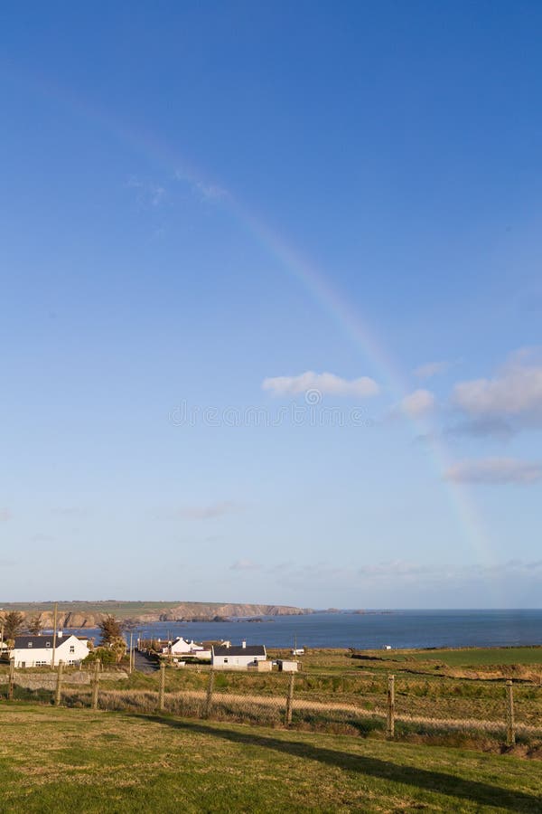Rainbow in Rural Irish Countryside Ending in the Irish Sea Stock Photo ...