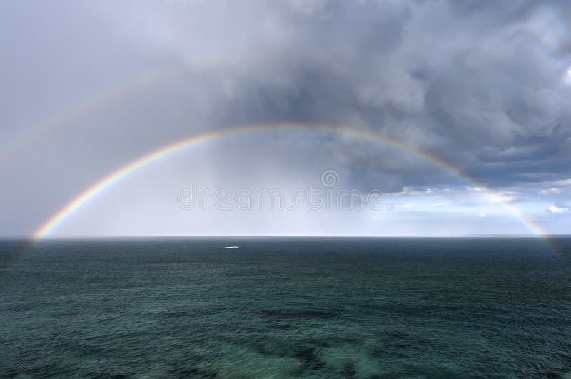 Rainbow and sea stock photo. Image of nature, color, environment - 16085532
