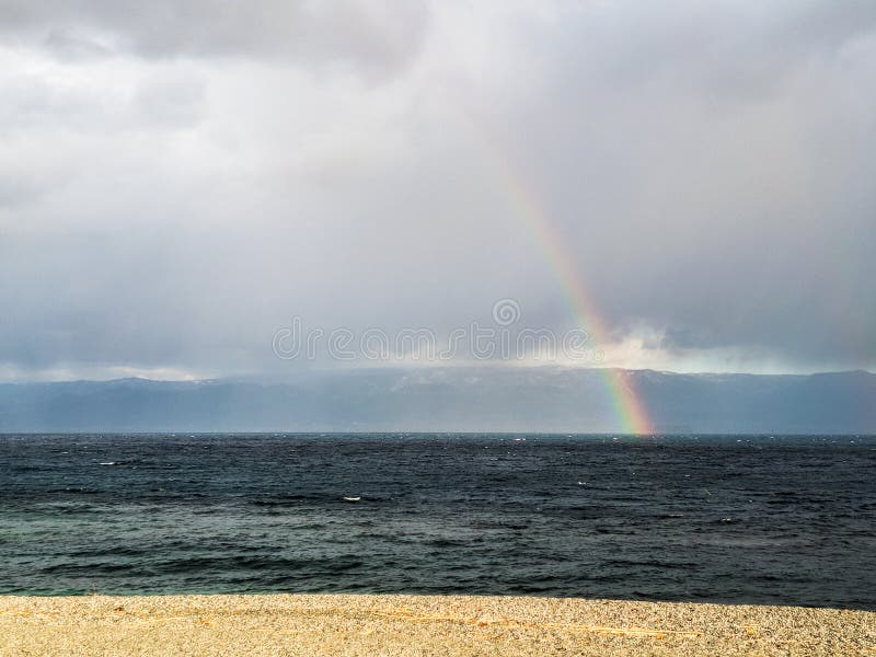 Rainbow in the sea stock photo. Image of atmosphere - 138558754