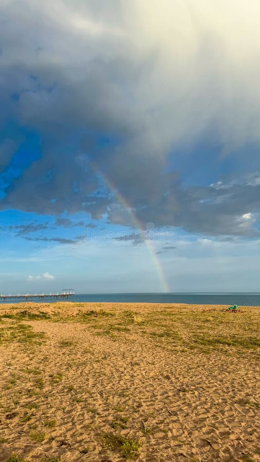 Rainbow on the Seashore. Sky after Rain and Sand. Stock Image - Image ...