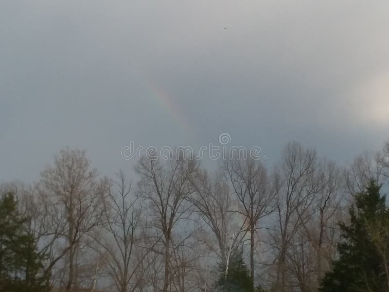 Rainbow in the Sky when it is Raining and the Sun Was Out Stock Photo ...