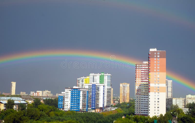 Rainbow in the Sky after a Thunderstorm. High-rise Buildings, Lots of ...