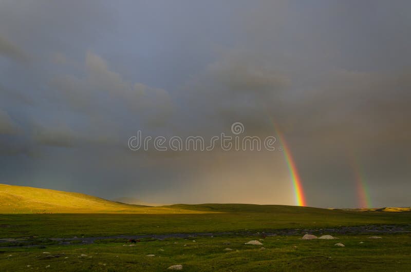 Rainbow in the Sky. Valley with Shadow, Beautiful Sky with Clouds and ...