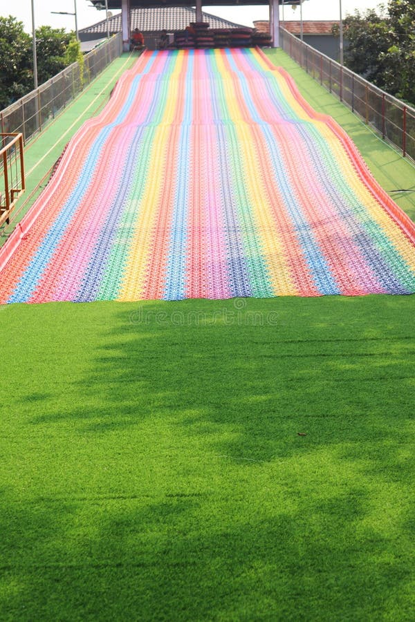 Playing Rainbow slide stock photo. Image of entertainment - 288936326