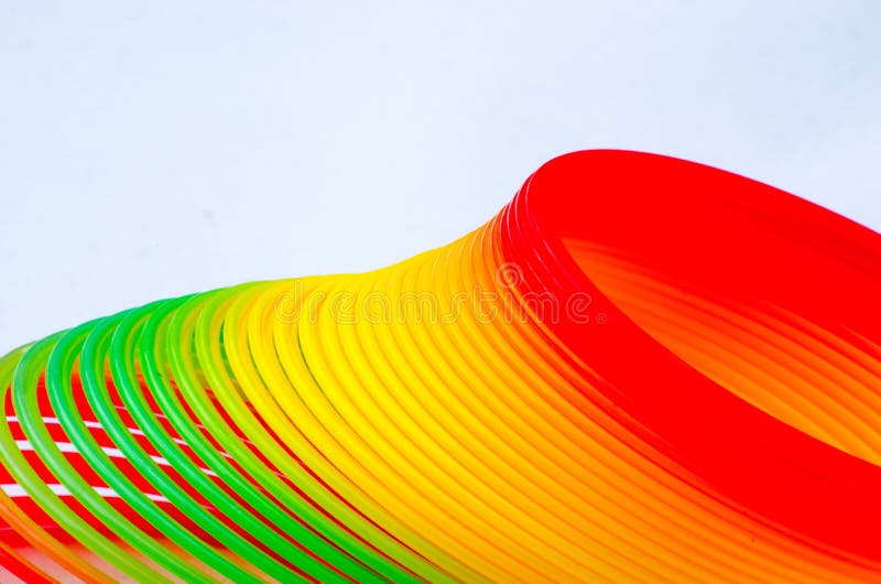A Rainbow Slinky or Spring editorial stock photo. Image of yellow ...