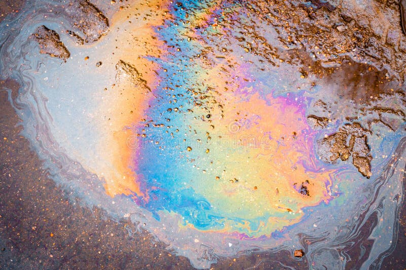 Rainbow Spots from Spilled Engine Oil in Puddle Stock Photo - Image of ...