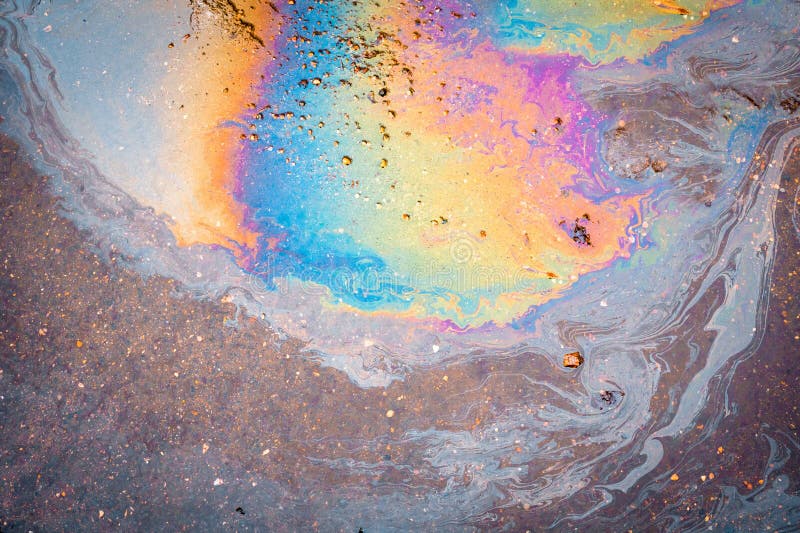 Rainbow Spots from Spilled Engine Oil in Puddle Stock Image - Image of ...