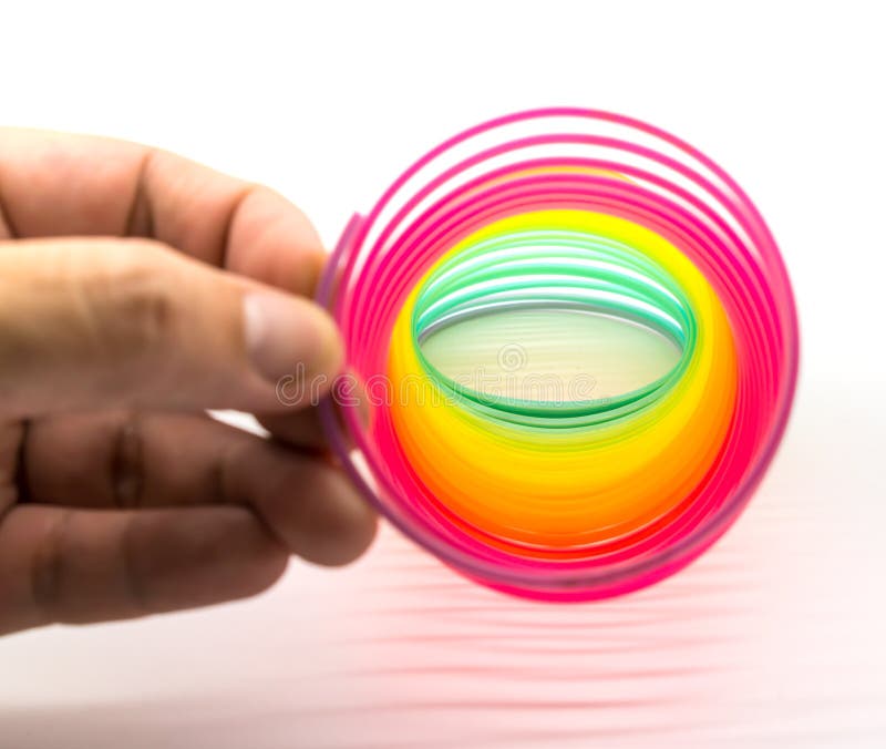 Rainbow plastic spring toy editorial image. Image of full - 10641490