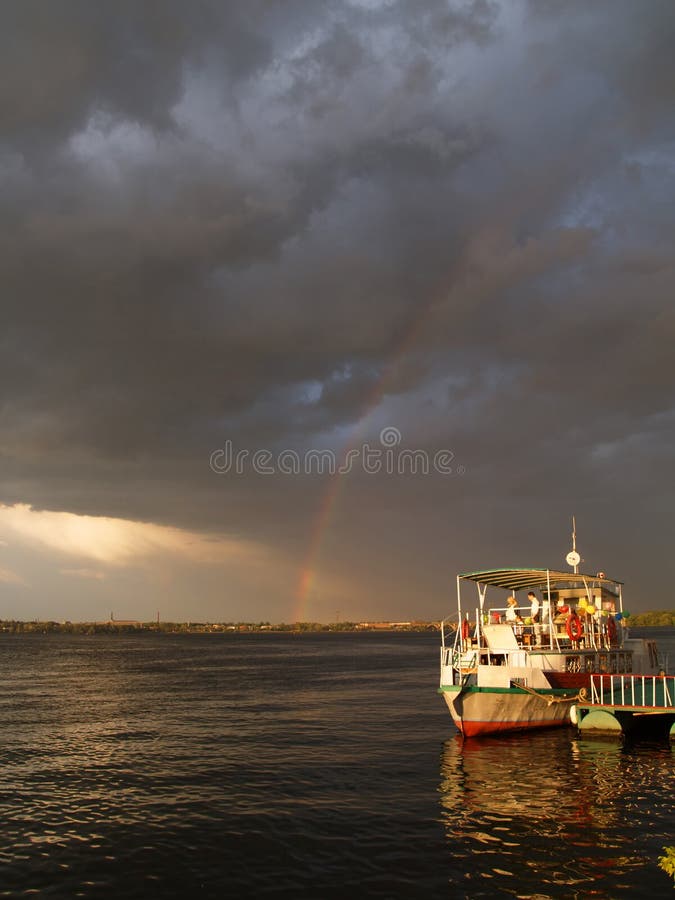 Rainbow after storm, boat stock image. Image of clouds - 2748327