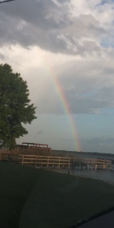 Touching a Rainbow in the Sky with Fingers Stock Photo - Image of ...