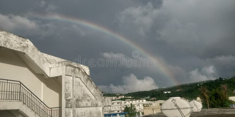 Rainbow Under the Dark Clouds Stock Image - Image of clear, beautiful ...