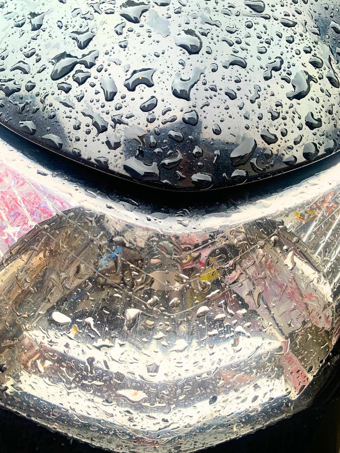Close-Up of Water Droplets on a Car Hood and Headlight after Rain Stock ...