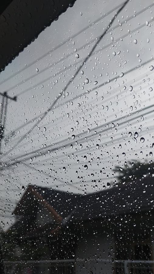 Raindrops Against Tangled Electrical Wires in the Background Stock ...