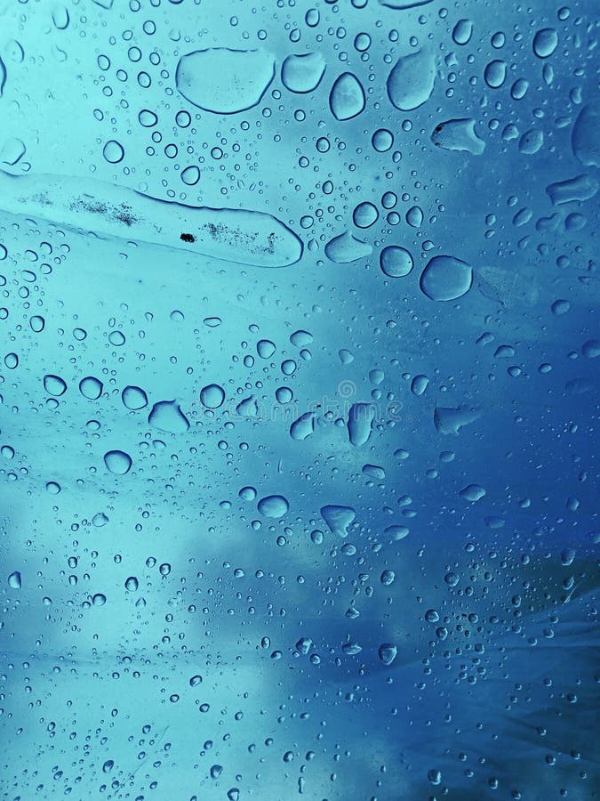 Raindrops on the Blue Plastic Cover the Leak of the House Stock Image ...