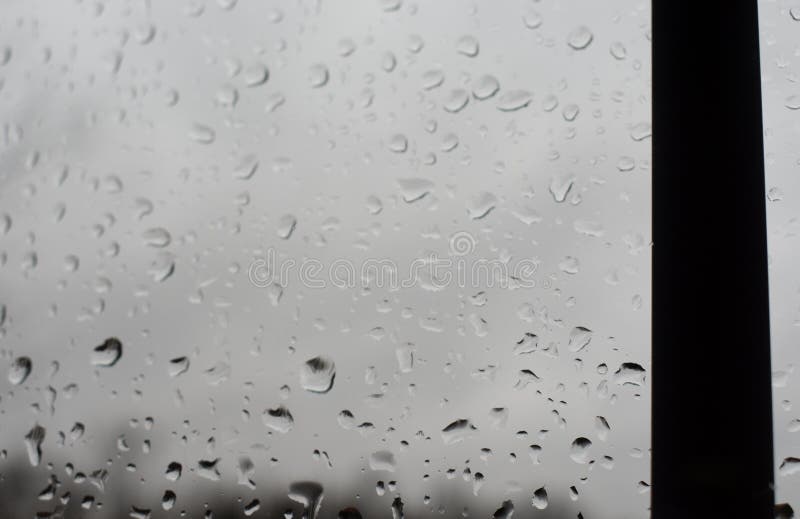 Raindrops on a Window with a Light Colored Background Stock Photo ...