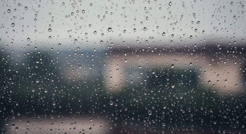 Raindrops Densely Scattered on a Glass Surface, Creating a Textured ...