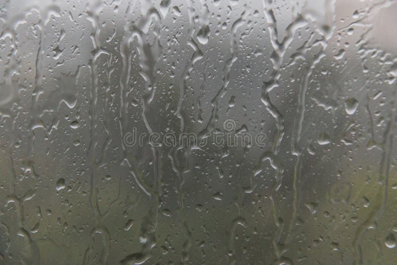 Raindrops Drip Down on the Window Glass. Soft Selective Focus Stock ...