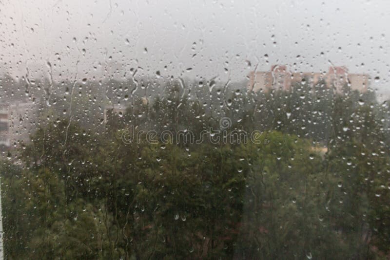 Raindrops Drip Down on the Window Glass. Soft Selective Focus Stock ...