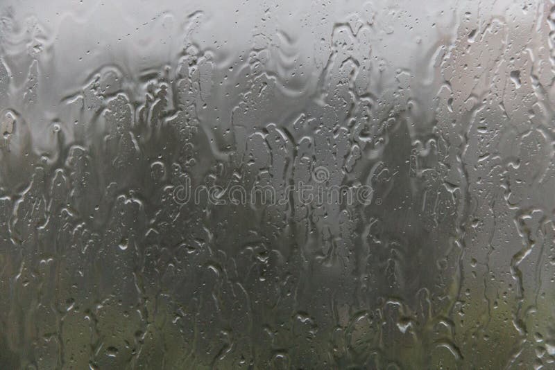 Raindrops Drip Down on the Window Glass. Soft Selective Focus Stock ...