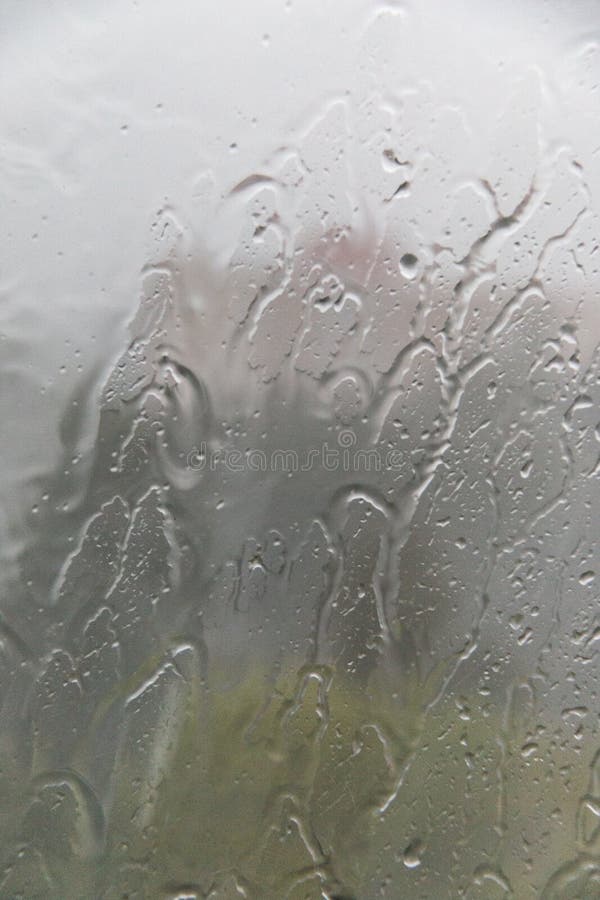 Raindrops Drip Down on the Window Glass. Soft Selective Focus Stock ...