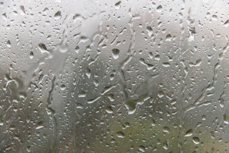 Raindrops Drip Down on the Window Glass. Soft Selective Focus Stock ...