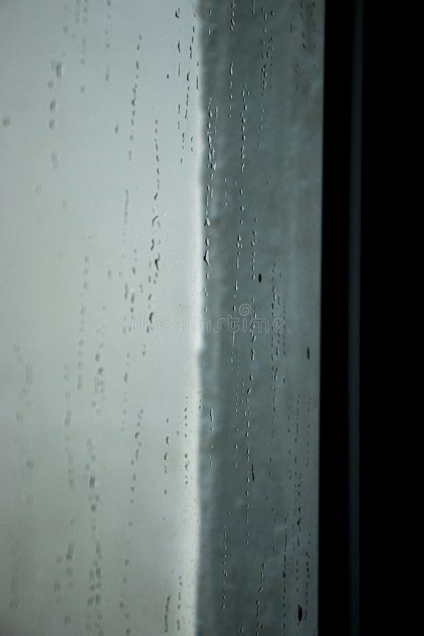 Raindrops Drip Down the Window after a Long Rain. Stock Photo - Image ...