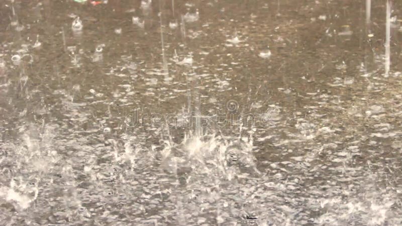 The Raindrops Dripping into the Puddle in Front of the House Stock ...