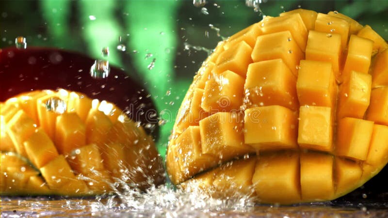 Raindrops Fall on Fresh Mango. Filmed on a High-speed Camera at 1000 ...