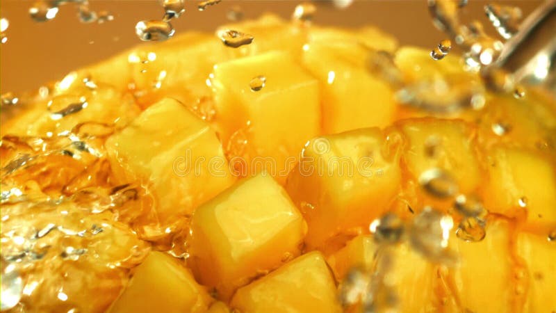 Raindrops Fall on Fresh Mango. Filmed on a High-speed Camera at 1000 ...