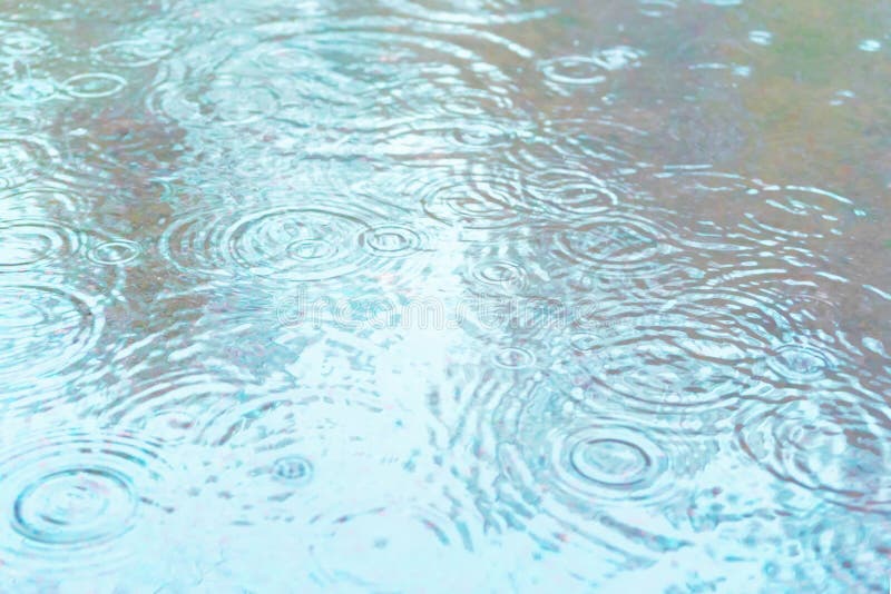 Raindrops Fall into a Puddle. Rainy Weather Stock Photo - Image of ...